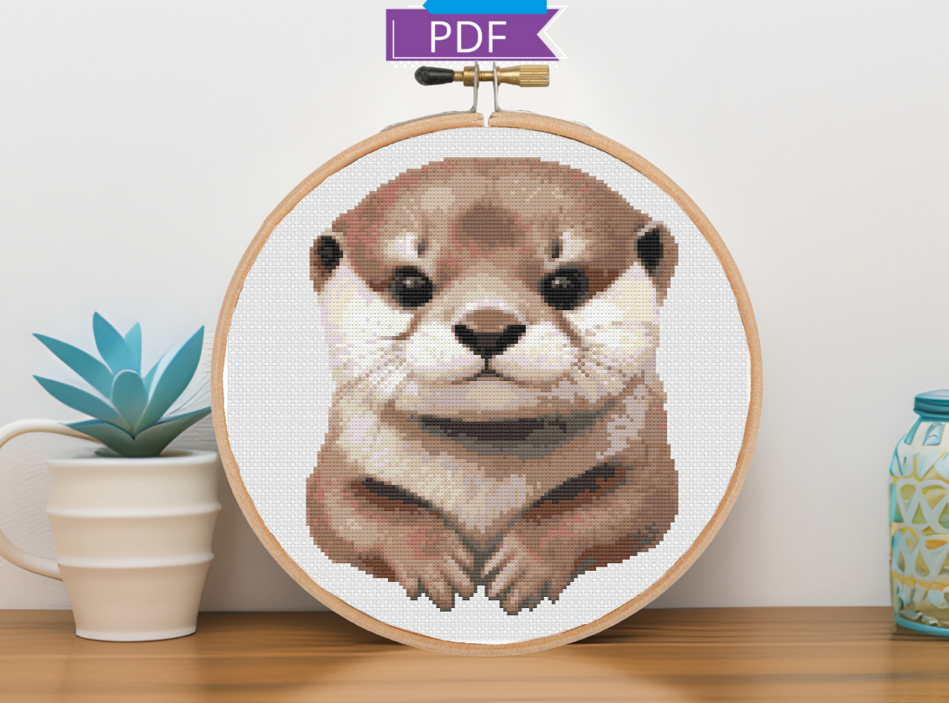 Cute otter cross stitch pattern